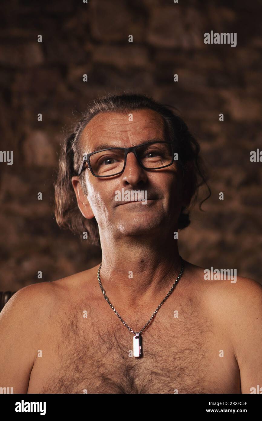 An older man, about 60 years old, of Serbian nationality with long hair ...