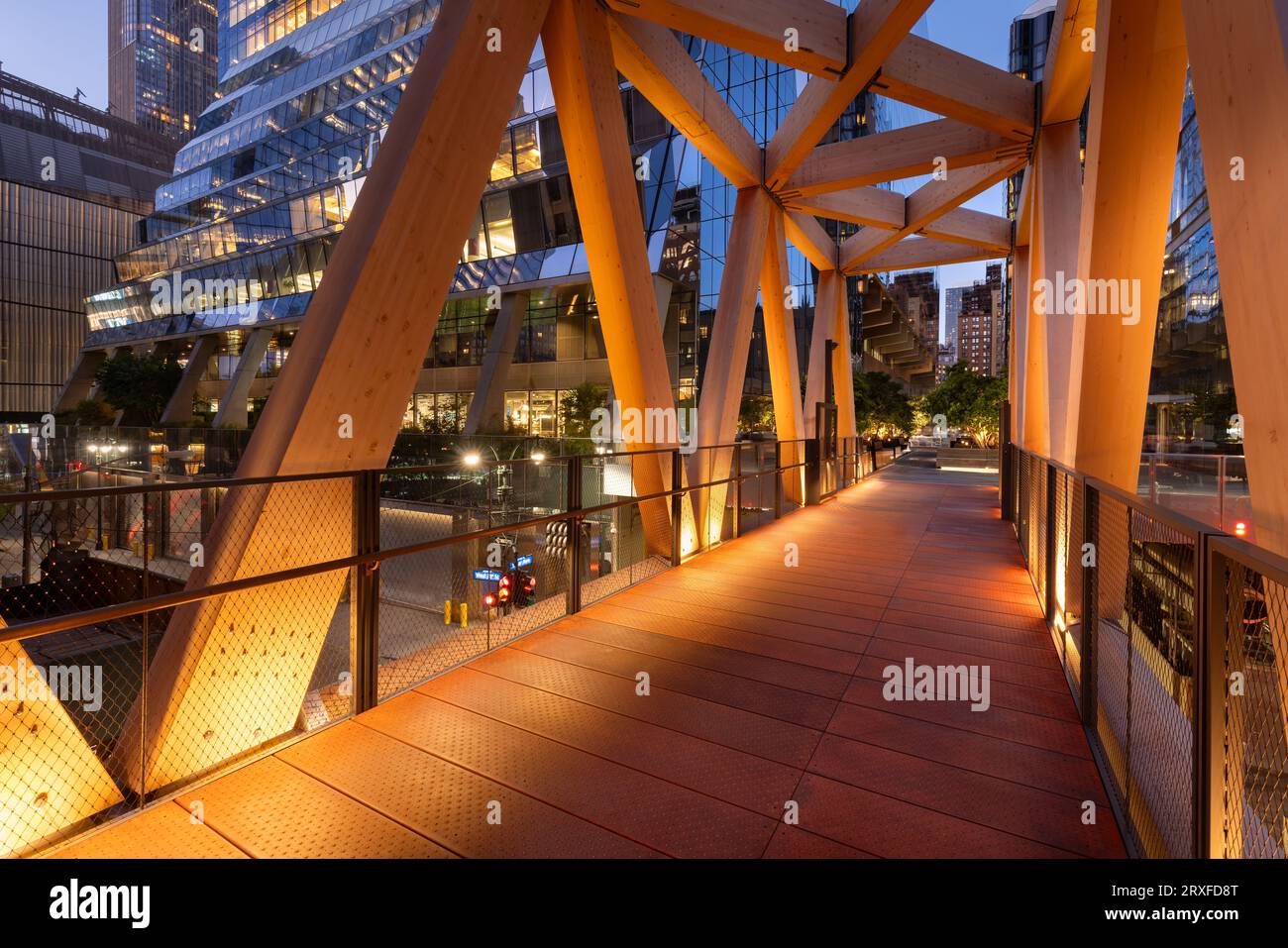 Evening in High Line public park with timber wooden truss bridge ...