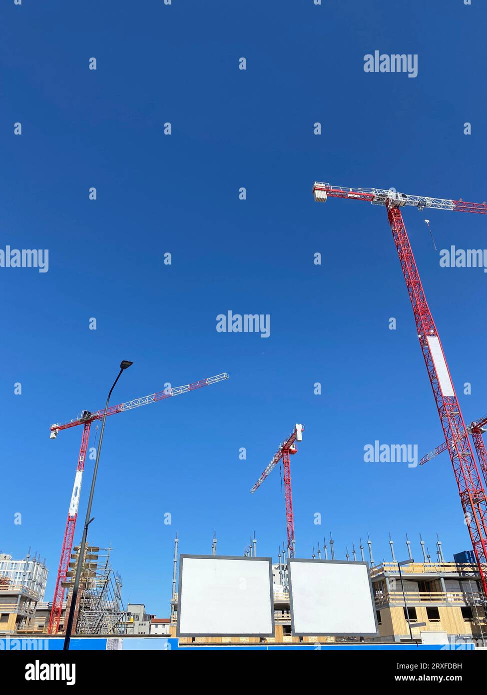 Work in progress street view of construction site in a bright sunny day ...