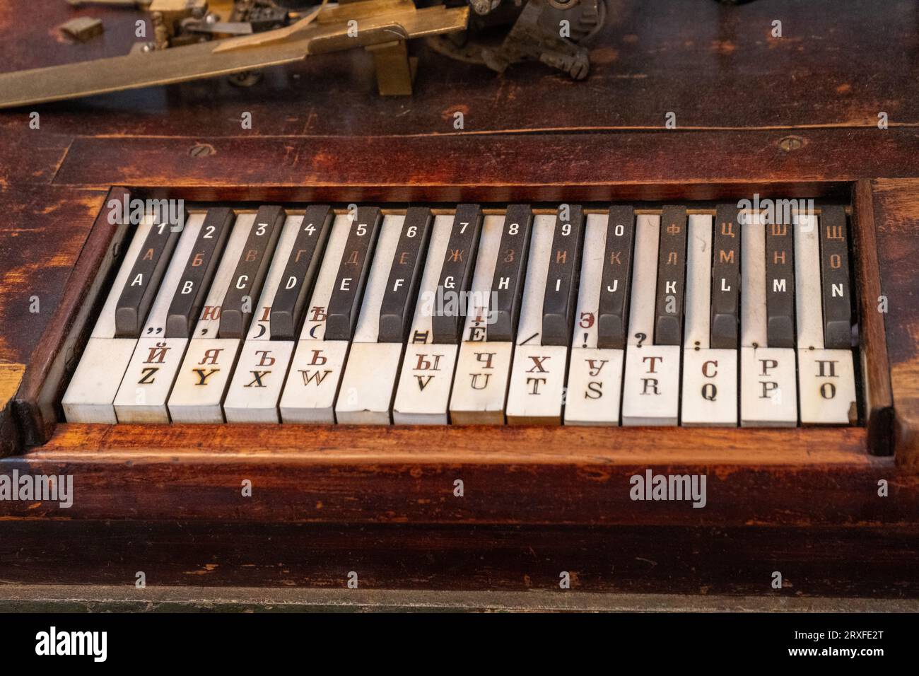 An old wooden telegraph with a keyboard and a tape. The first means of ...