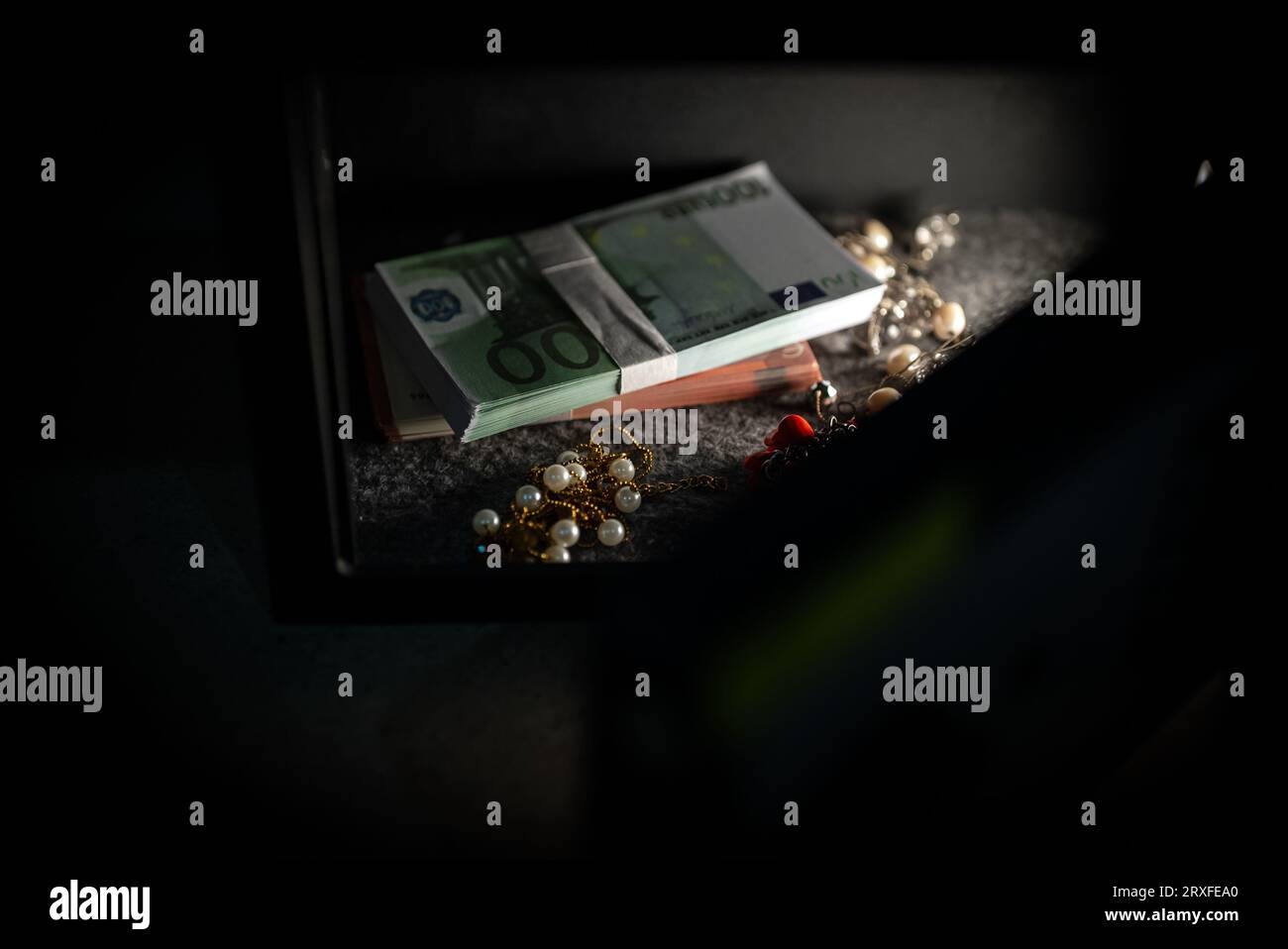 Burglarized steel safe with euro banknotes and jewelry Stock Photo - Alamy