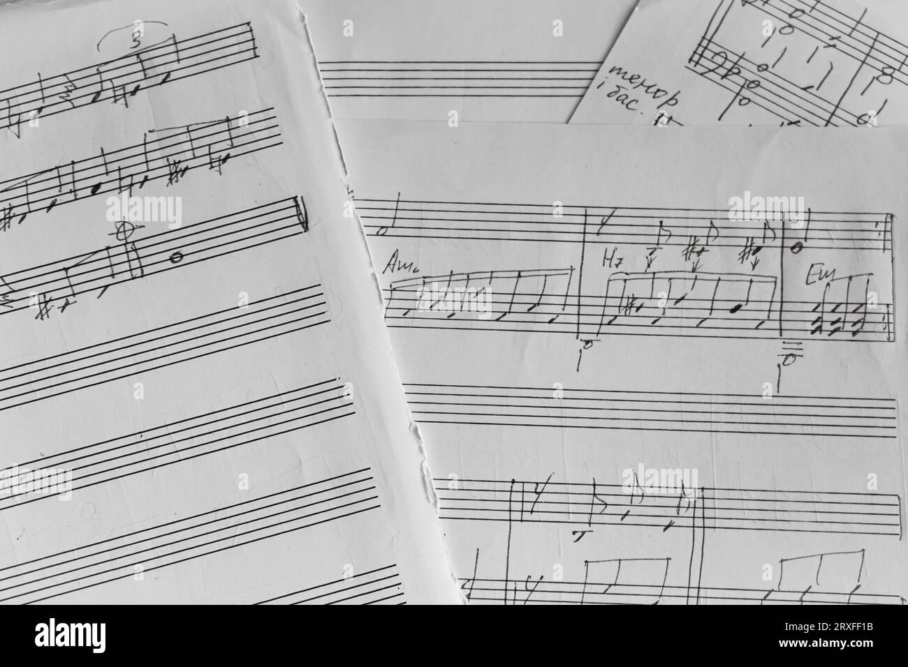 Notes on paper, monochrome. Old music sheet, black and white. Melody on ...