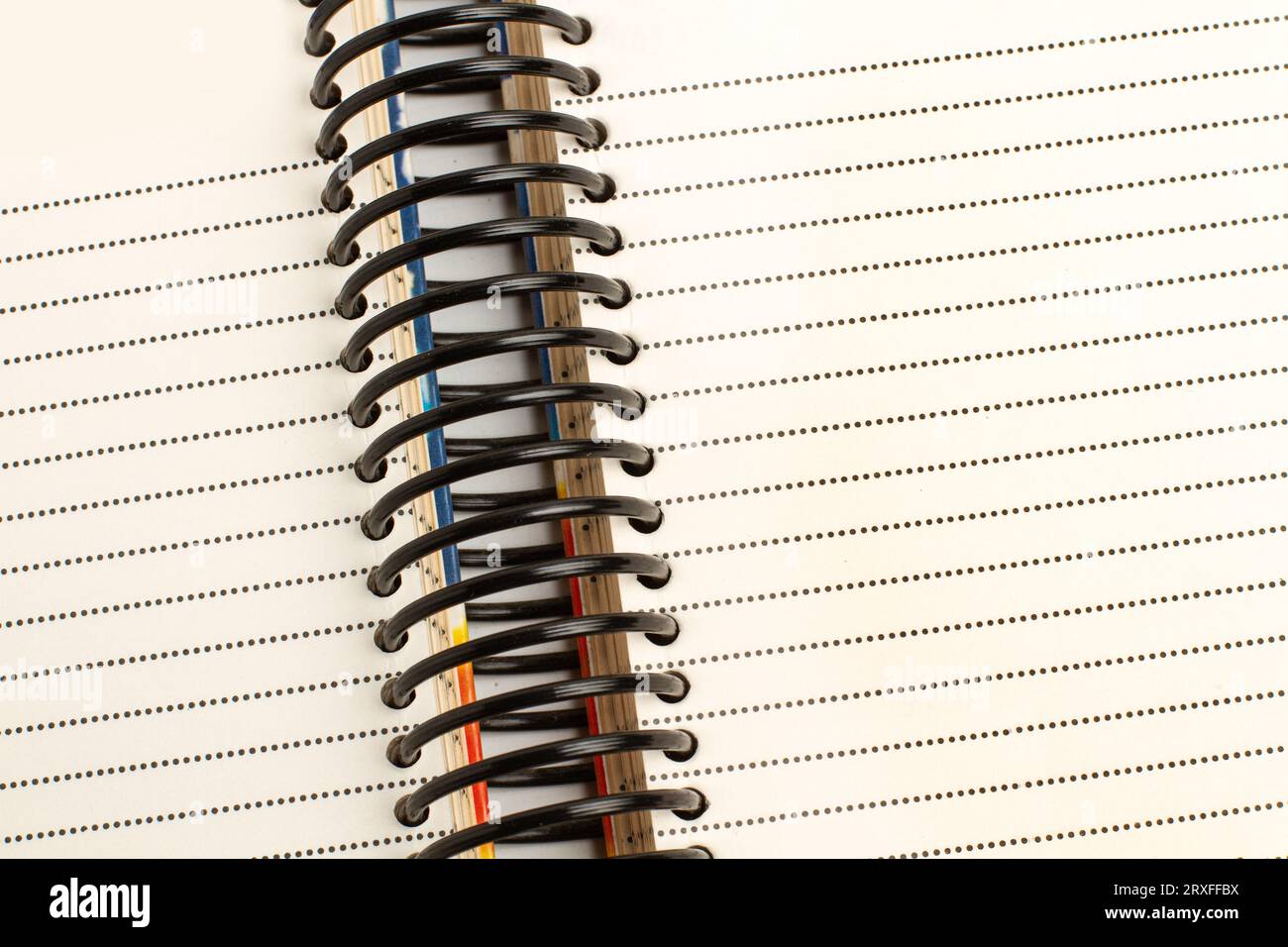 A spiral dotted line notebook in a close up view Stock Photo - Alamy