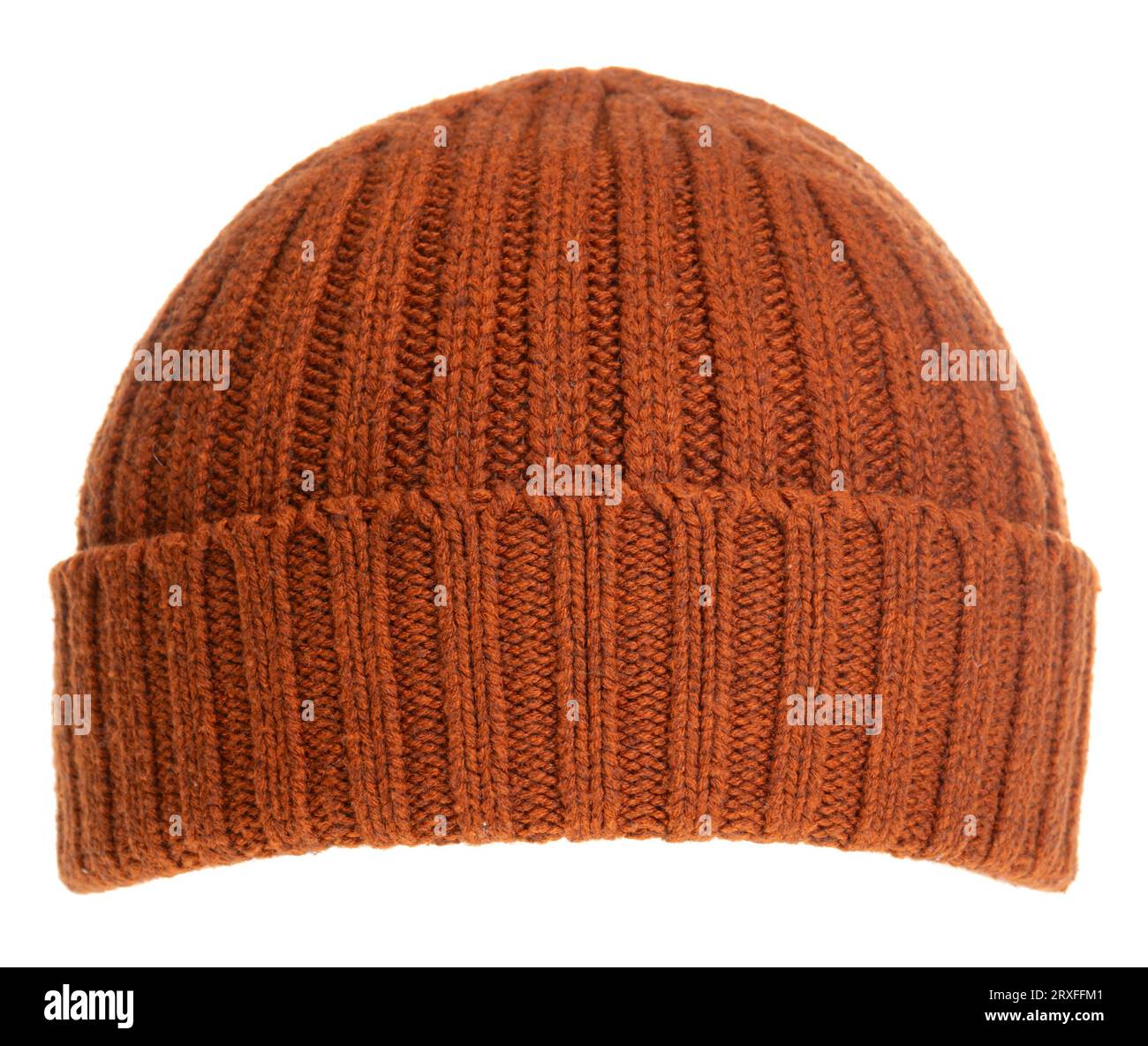 Orange-brown knitted winter bobble hat of traditional design isolated ...