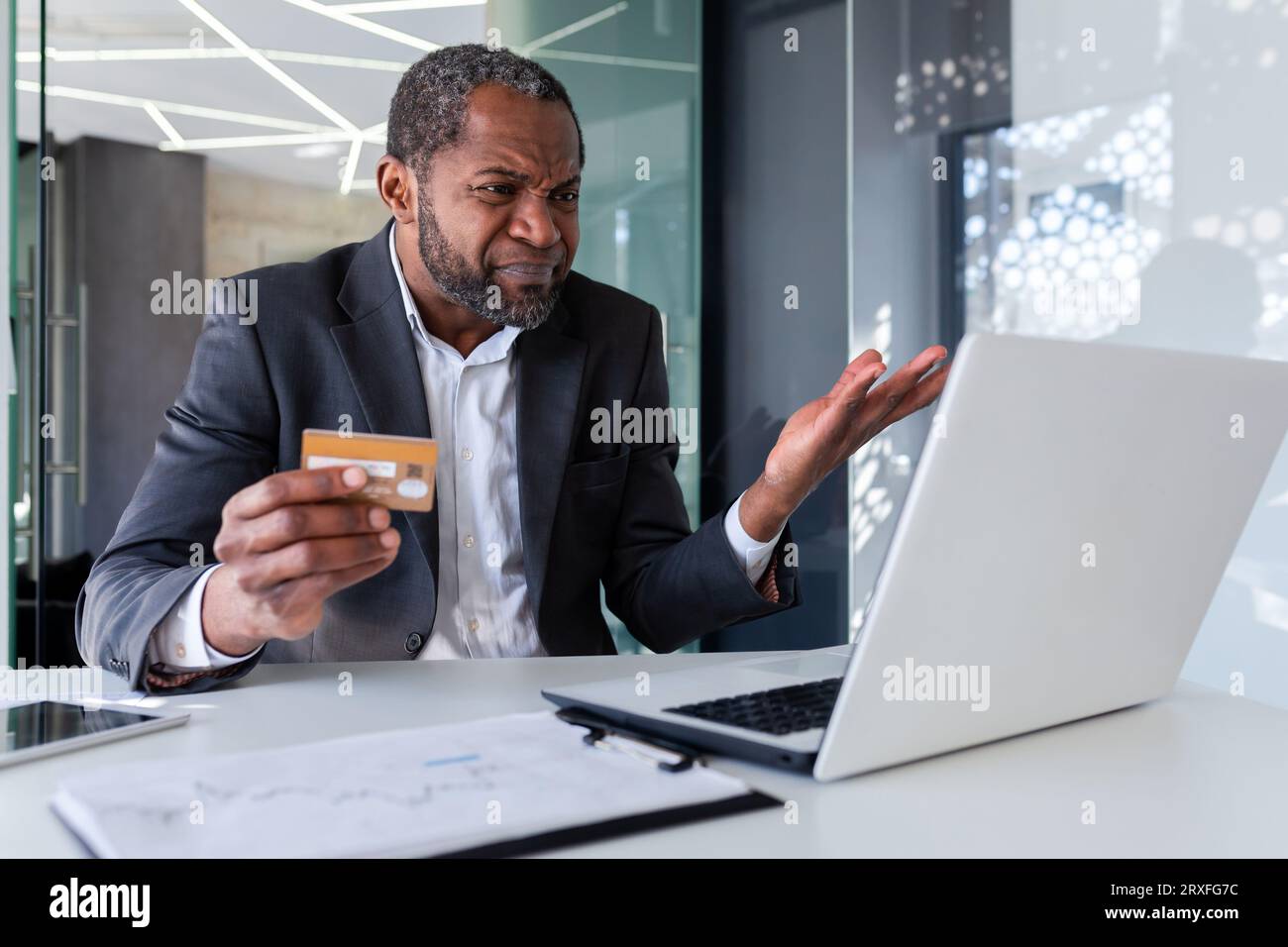 Upset and worried businessman at workplace, man cheated received online ...