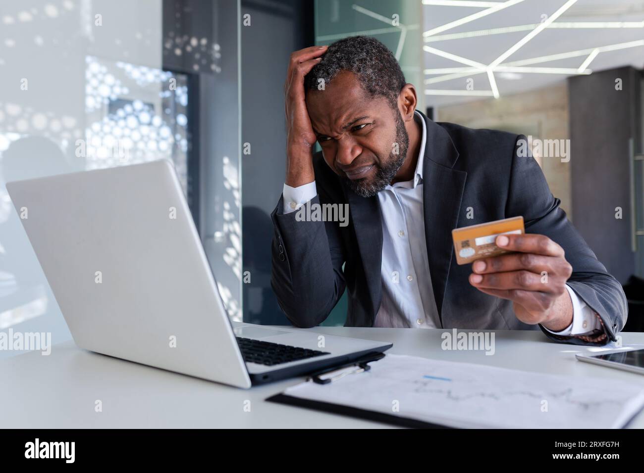 Upset and worried businessman at workplace, man cheated received online ...