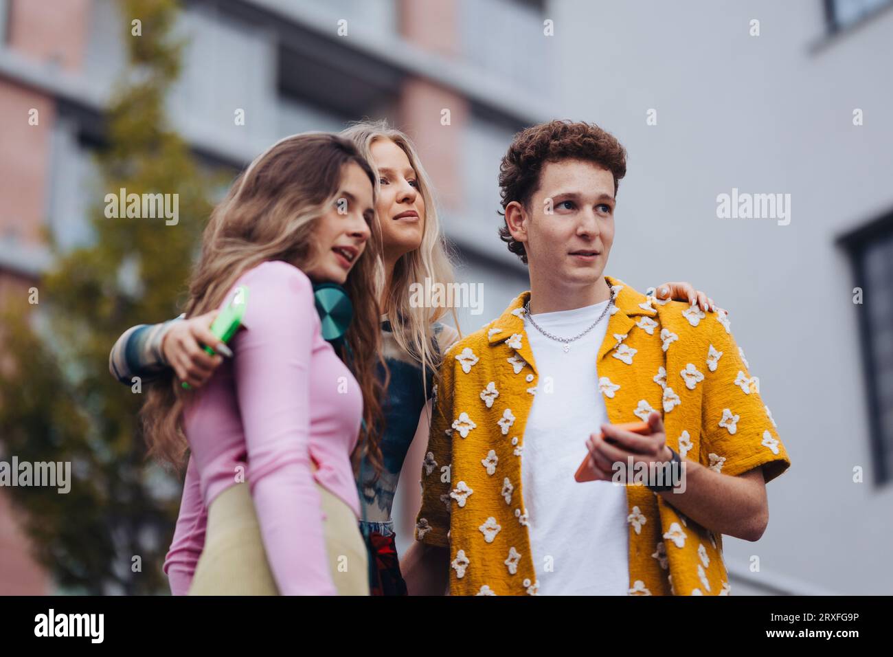 Generation z students hanging out together outdoors in the city Stock ...