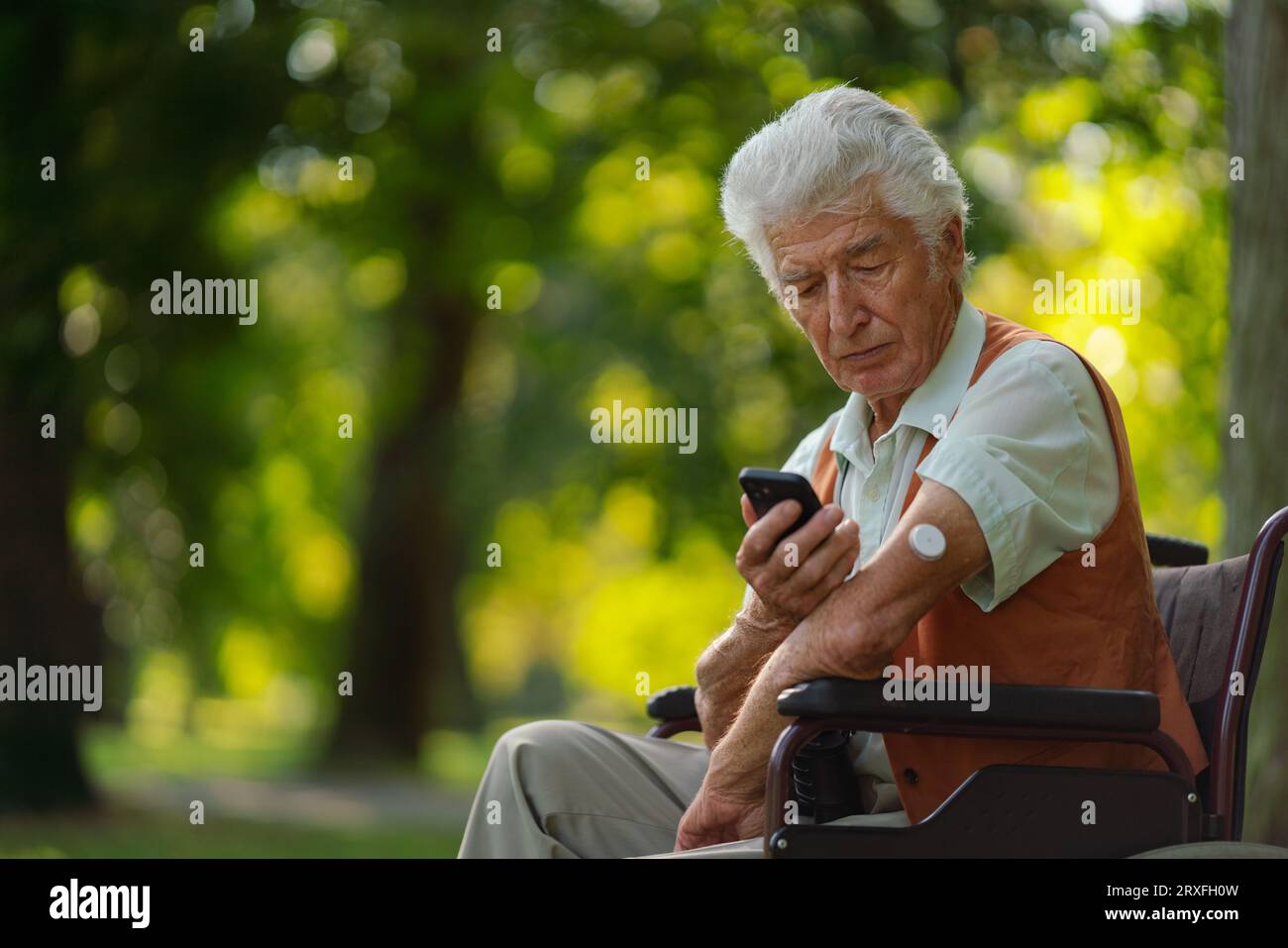 Man checking blood glucose phone hi-res stock photography and images ...
