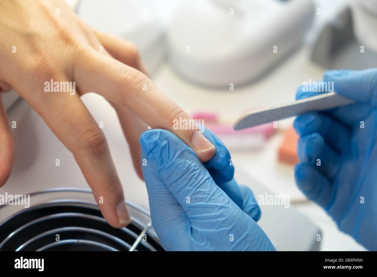 Female hands and tools for manicure, process of performing manicure ...