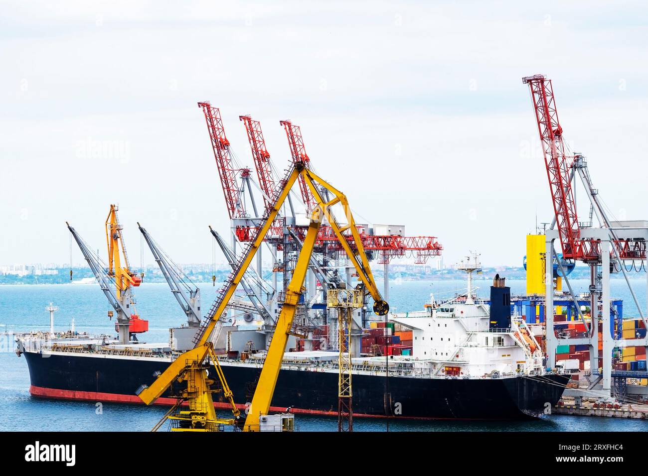 Port Cranes on a Pier of Seaport. Industrial freight.Container terminal ...