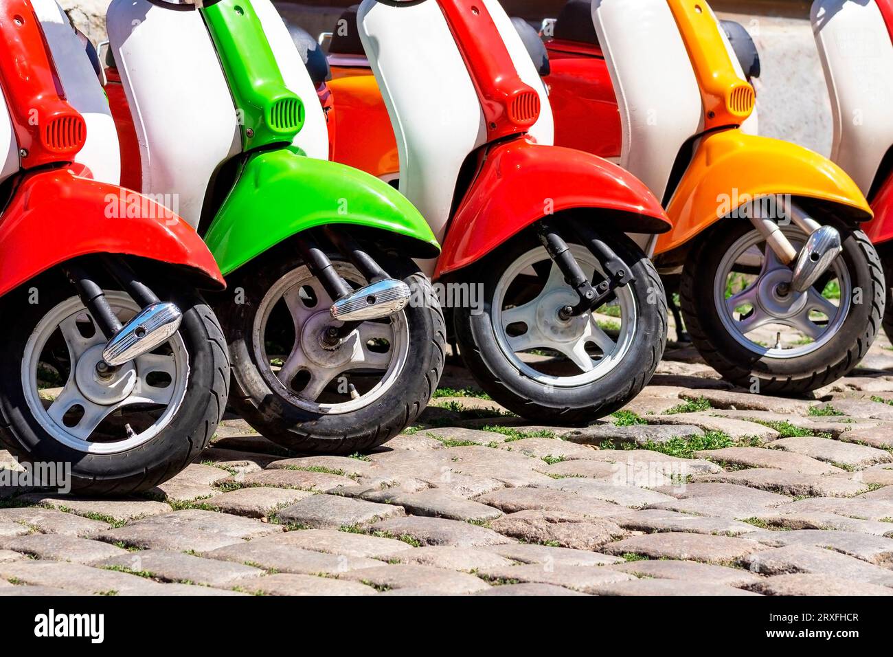 vintage scooters parked on sidewalk. Vintage scooters on a city street ...