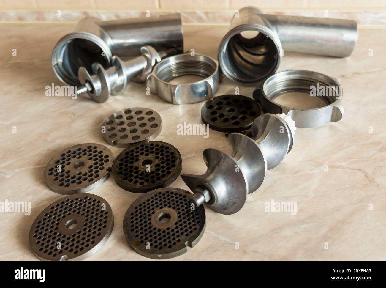 details of a meat grinder, elements of a kitchen device, disassembled ...