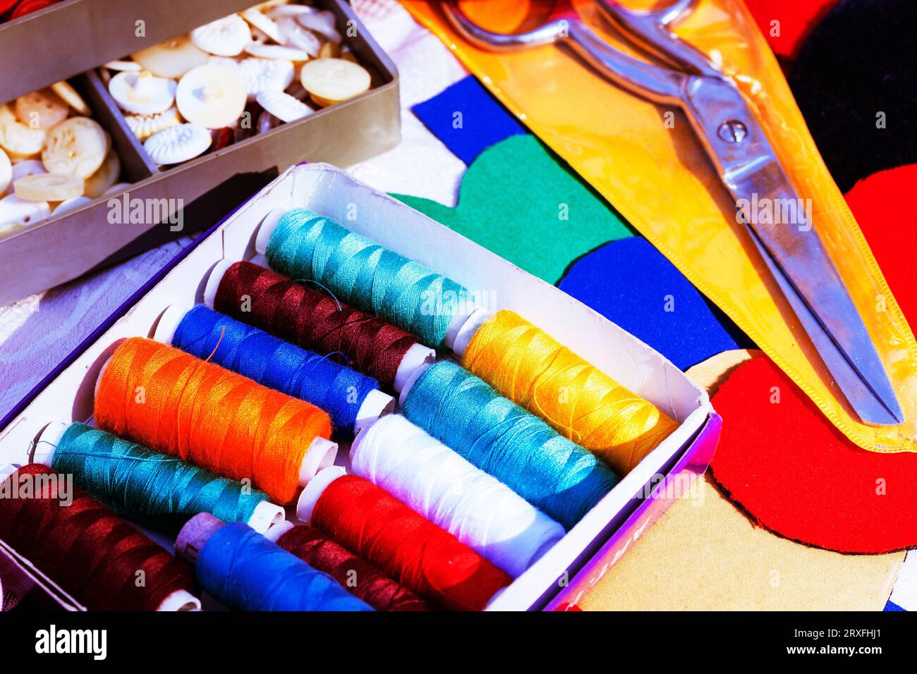 Threads, scissors and fabrics. Objects for sewing.close-up Accessories ...