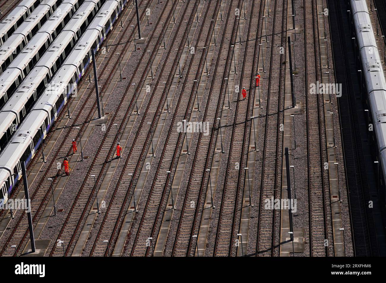 Railway workers and trains at Elizabeth Line depot at Old Oak Common ...