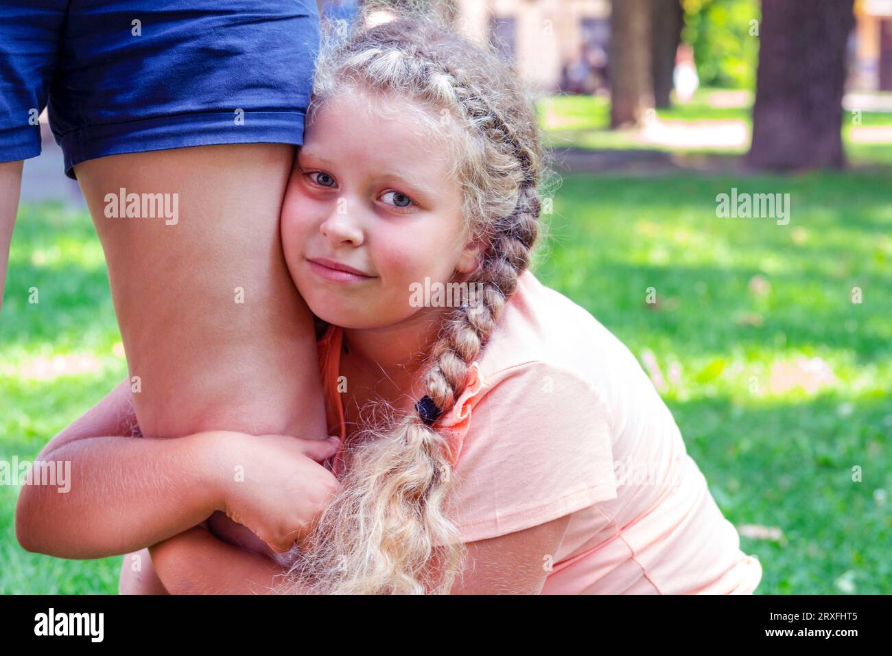 Child holding mom leg hi-res stock photography and images - Alamy