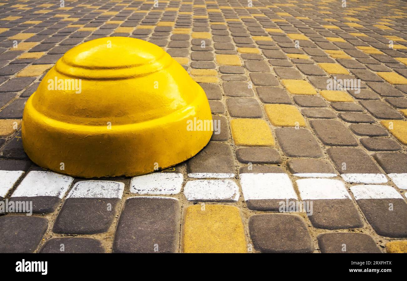 concrete hemispheres prohibiting parking barrier. The drive and the ...