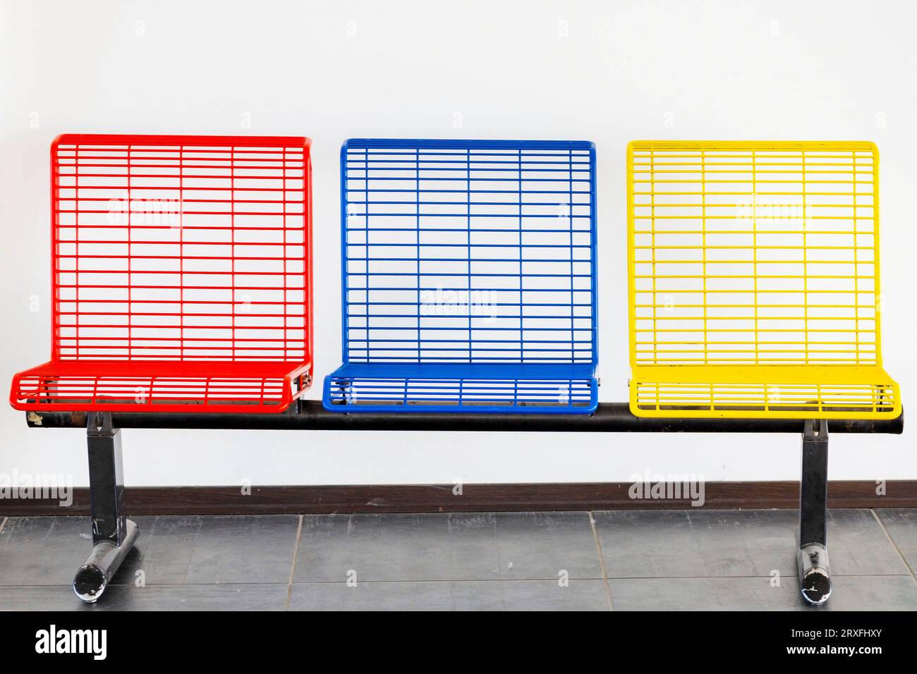 Metal bench, seats of colors. The spot on a white background front view ...