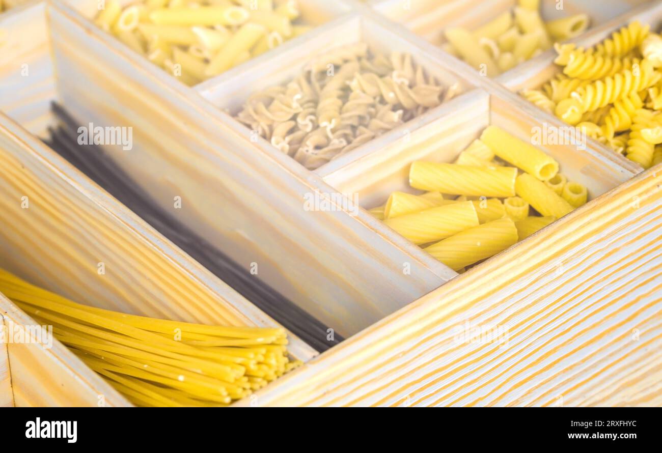 Assorted pastas in wooden box. Italian pasta collection on rustic ...