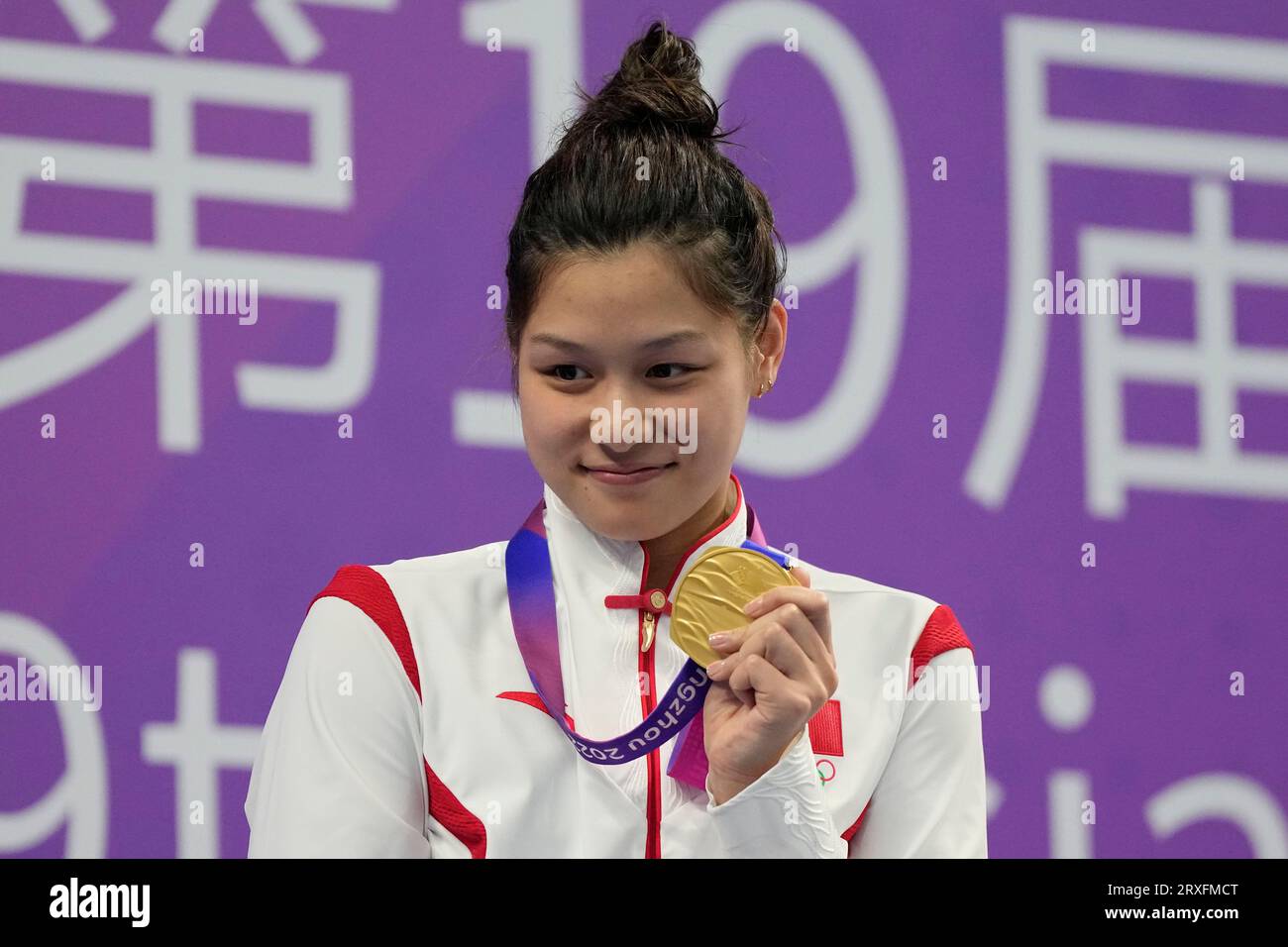Gold medalist Yu Yiting of China celebrates during the victory ceremony ...
