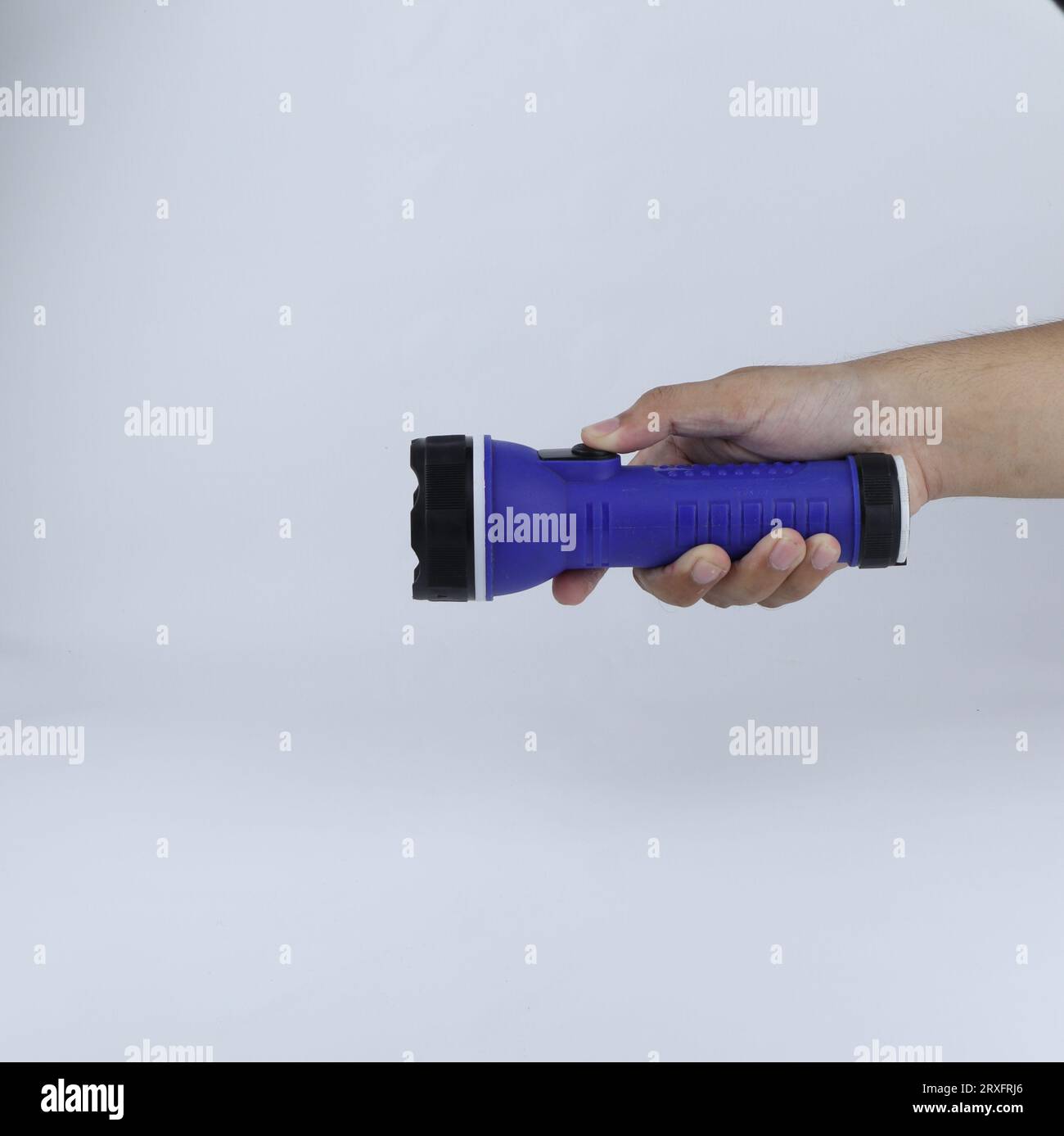 hand holding a flashlight isolated on a white background Stock Photo ...