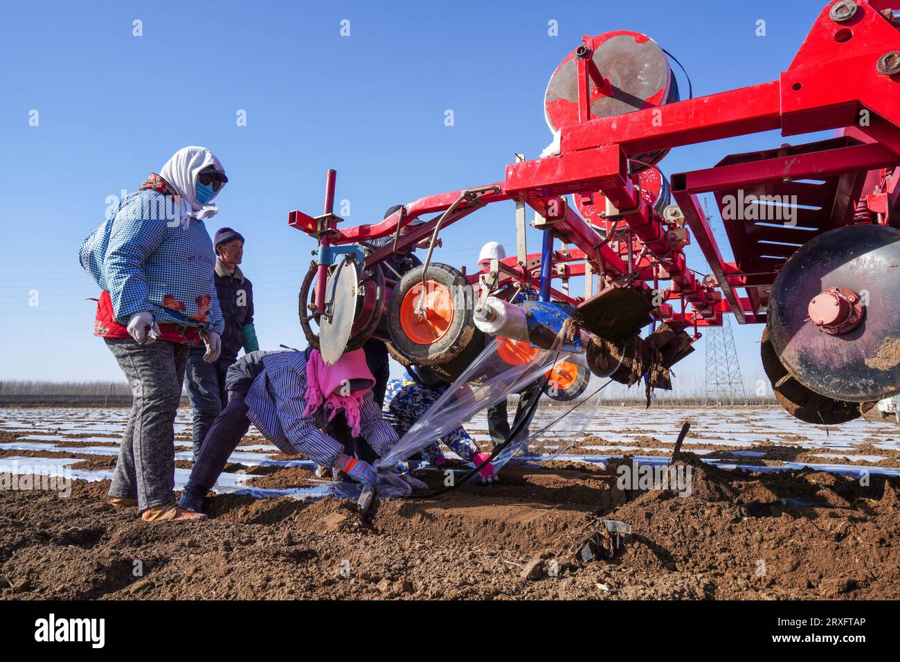 Luannan County, China - March 15, 2023: Farmers use planters to grow ...