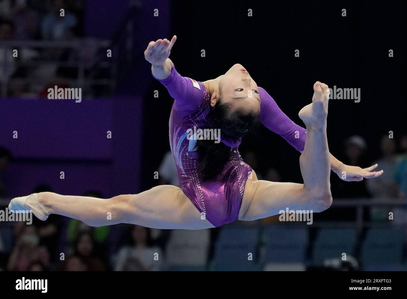 Mana Okamura of Japan competes on balance beam at the women's team ...