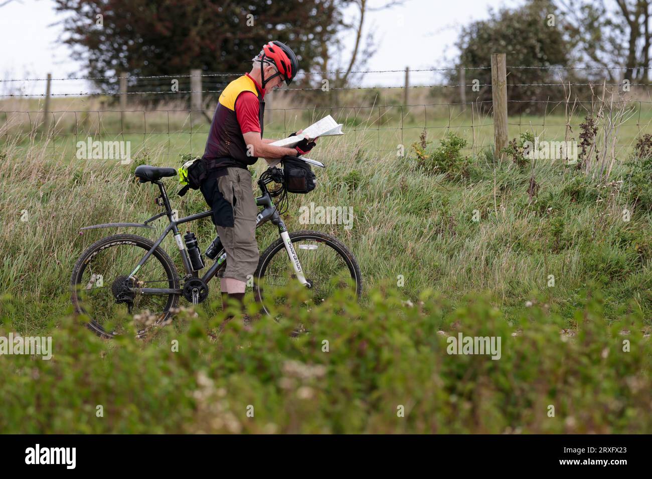 Cyclist reading directions on map hi-res stock photography and images ...