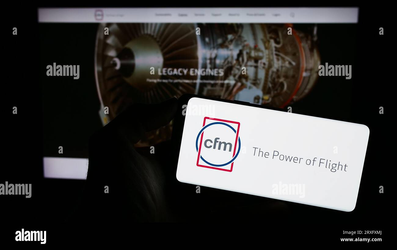 Person holding cellphone with logo of aircraft engine company CFM ...