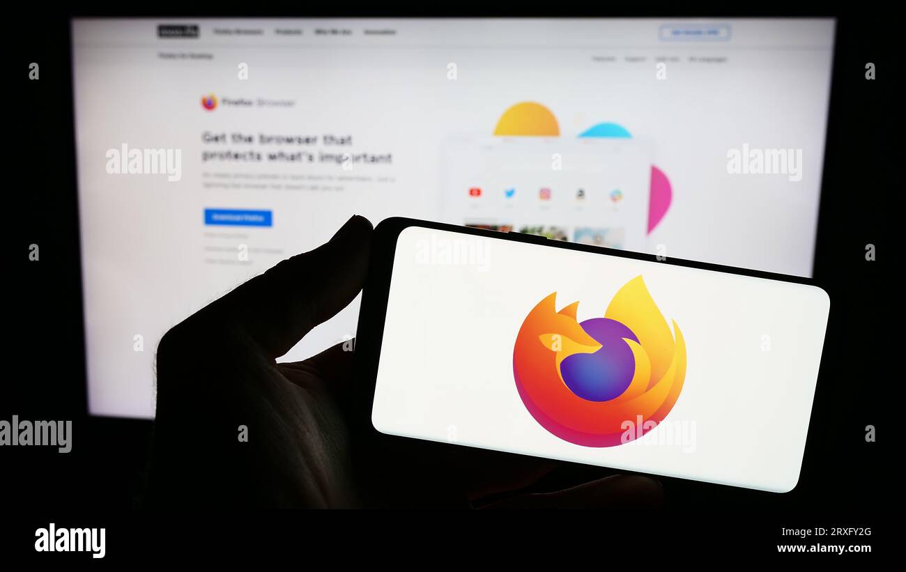 Person holding smartphone with logo of open-source web browser Mozilla ...