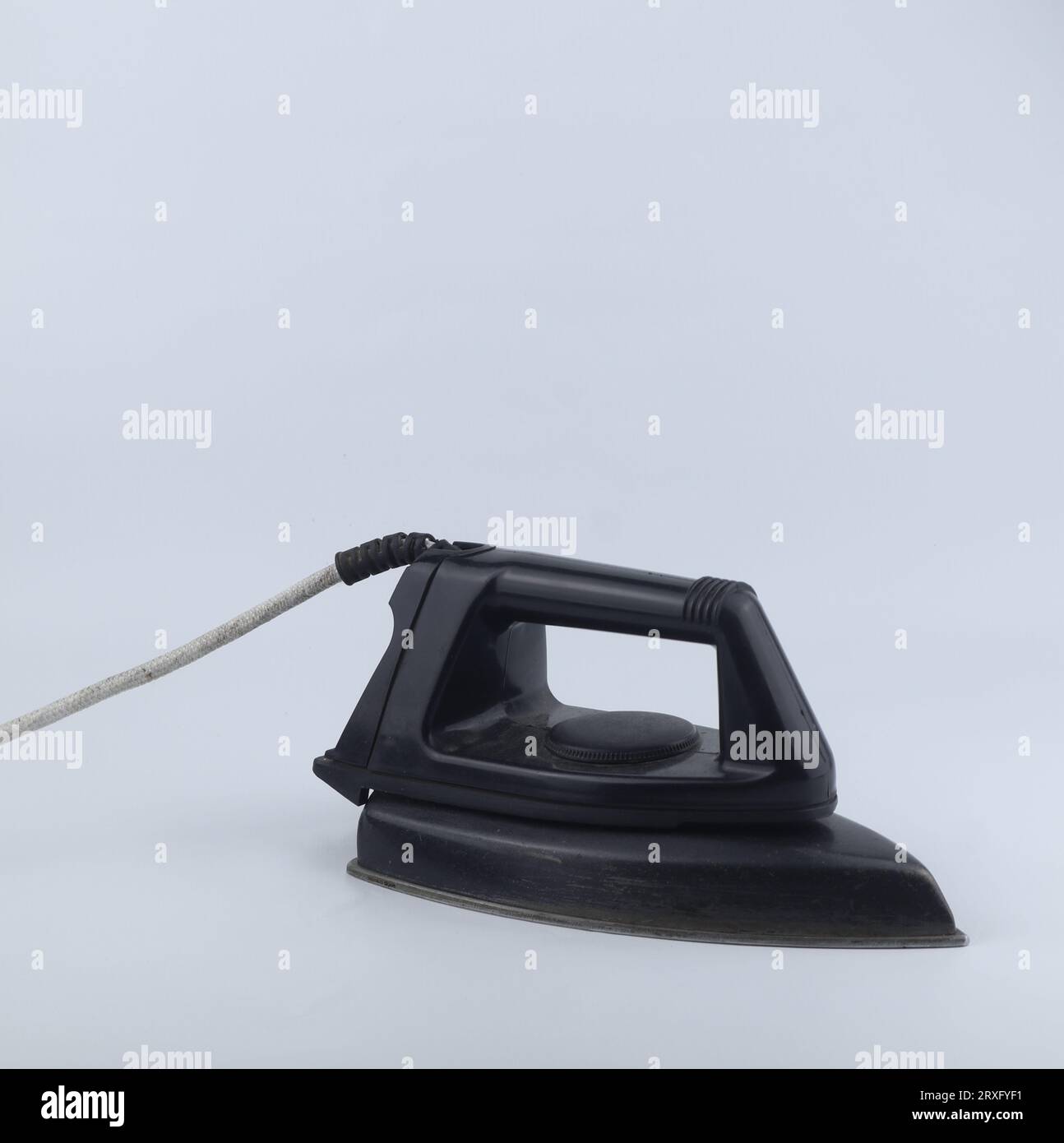 electric iron isolated on a white background Stock Photo - Alamy