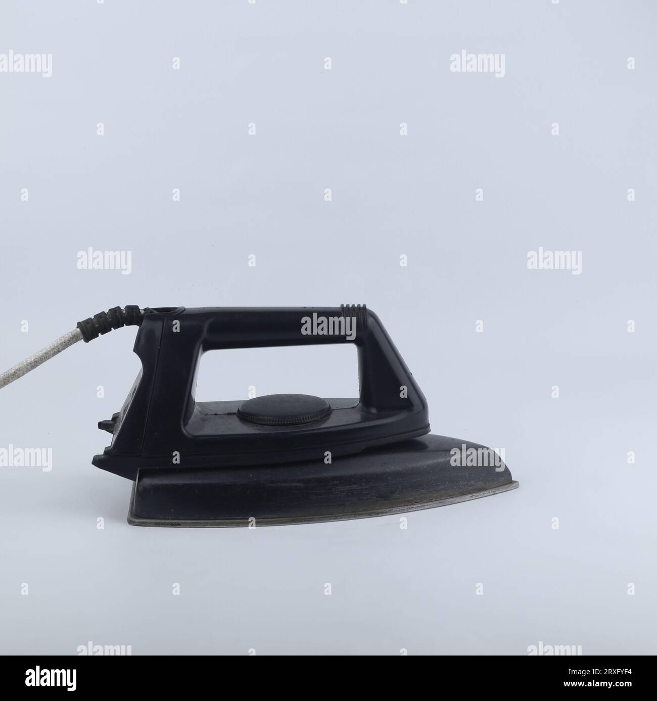 electric iron isolated on a white background Stock Photo - Alamy