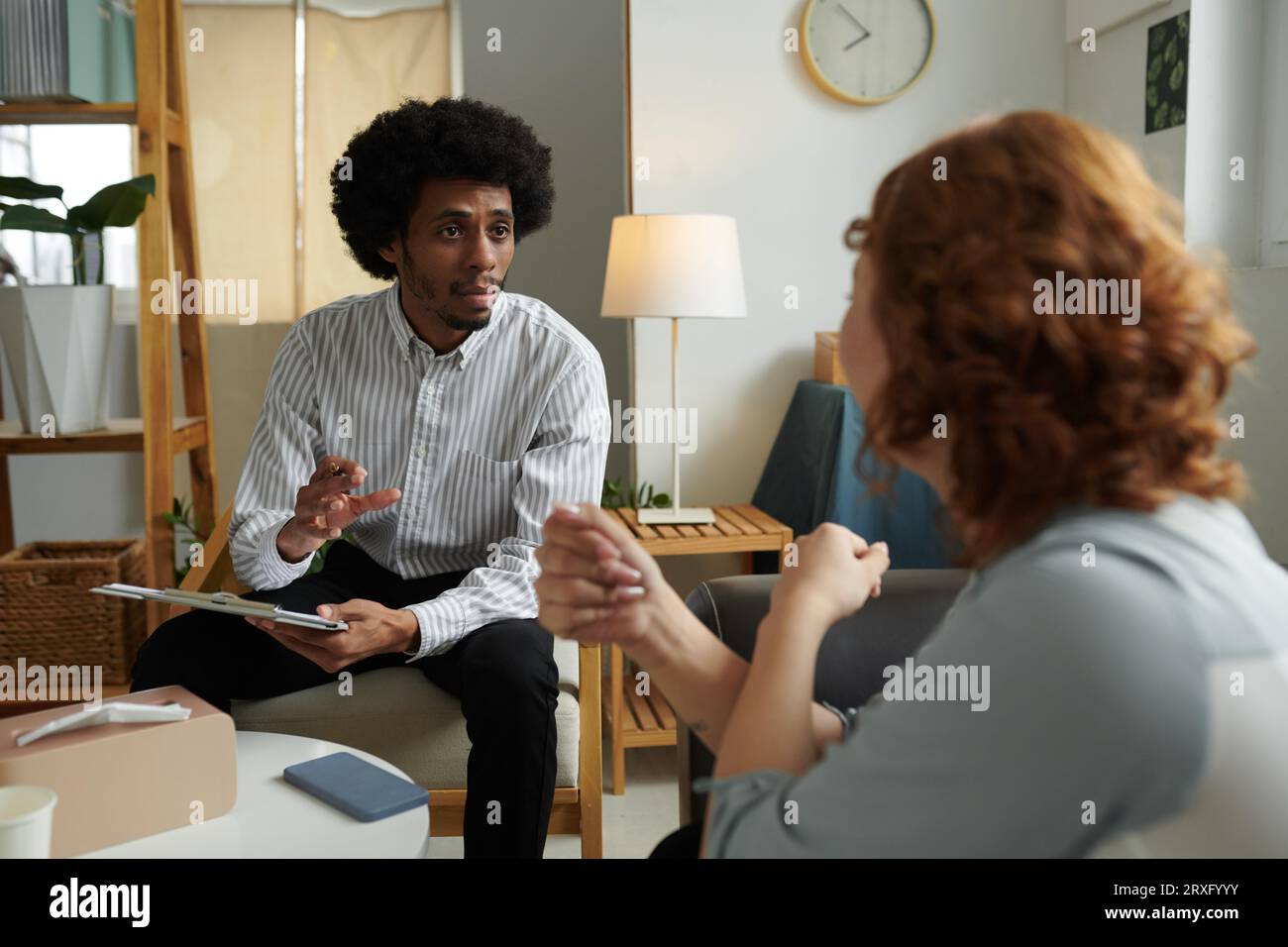 Psychotherapist talking to patient about her life choices Stock Photo ...