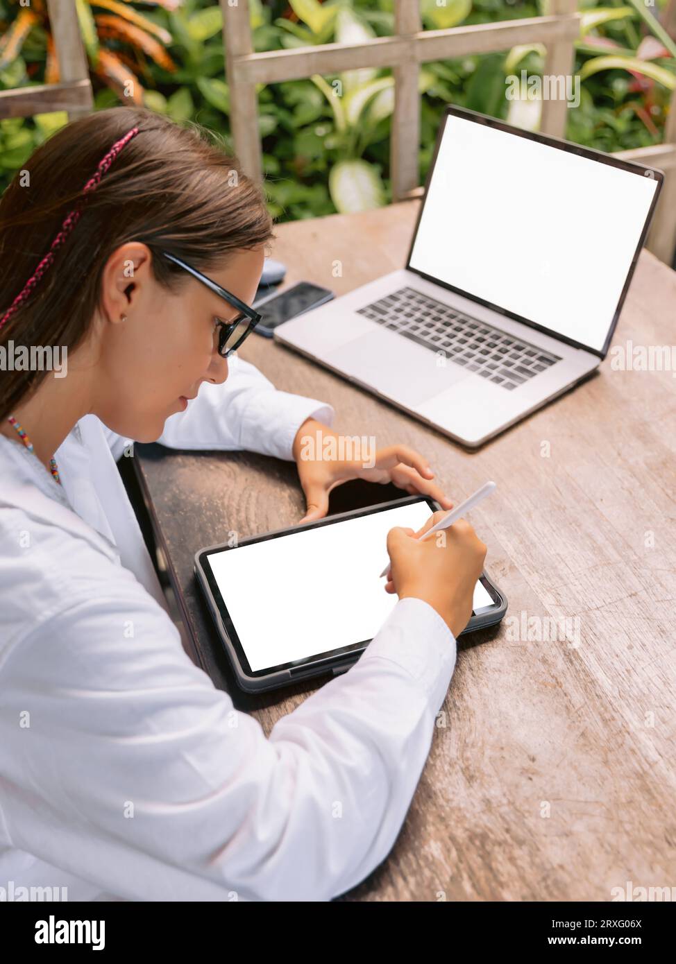 Professional using computer outdoor hi-res stock photography and images ...