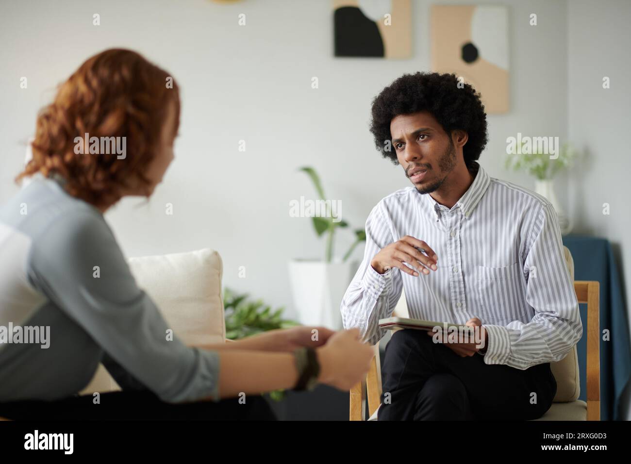 Therapist asking client to tell more about her childhood Stock Photo ...