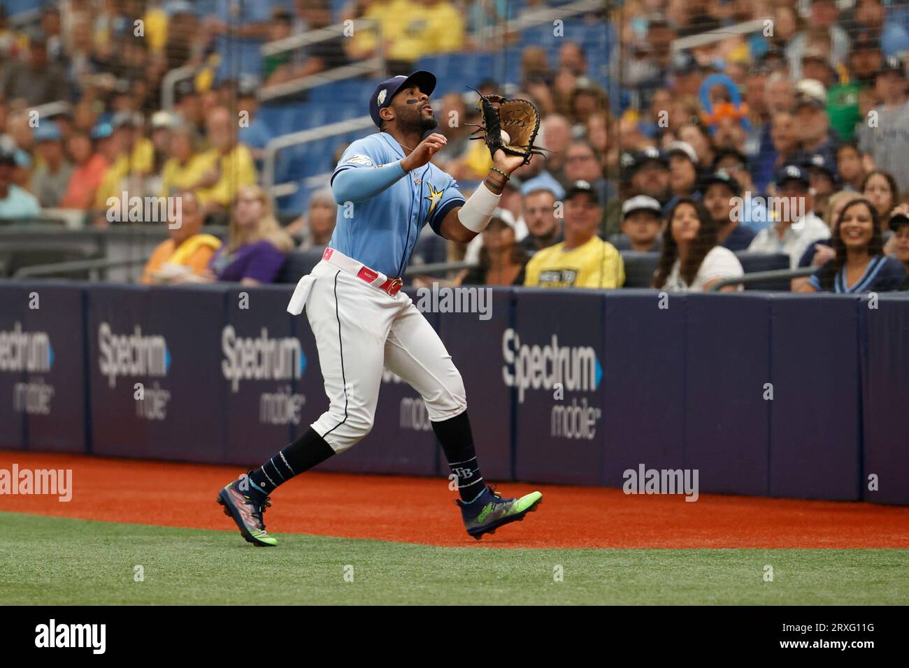 Tampa Bay Rays first baseman Yandy Diaz catches a foul ball during a ...