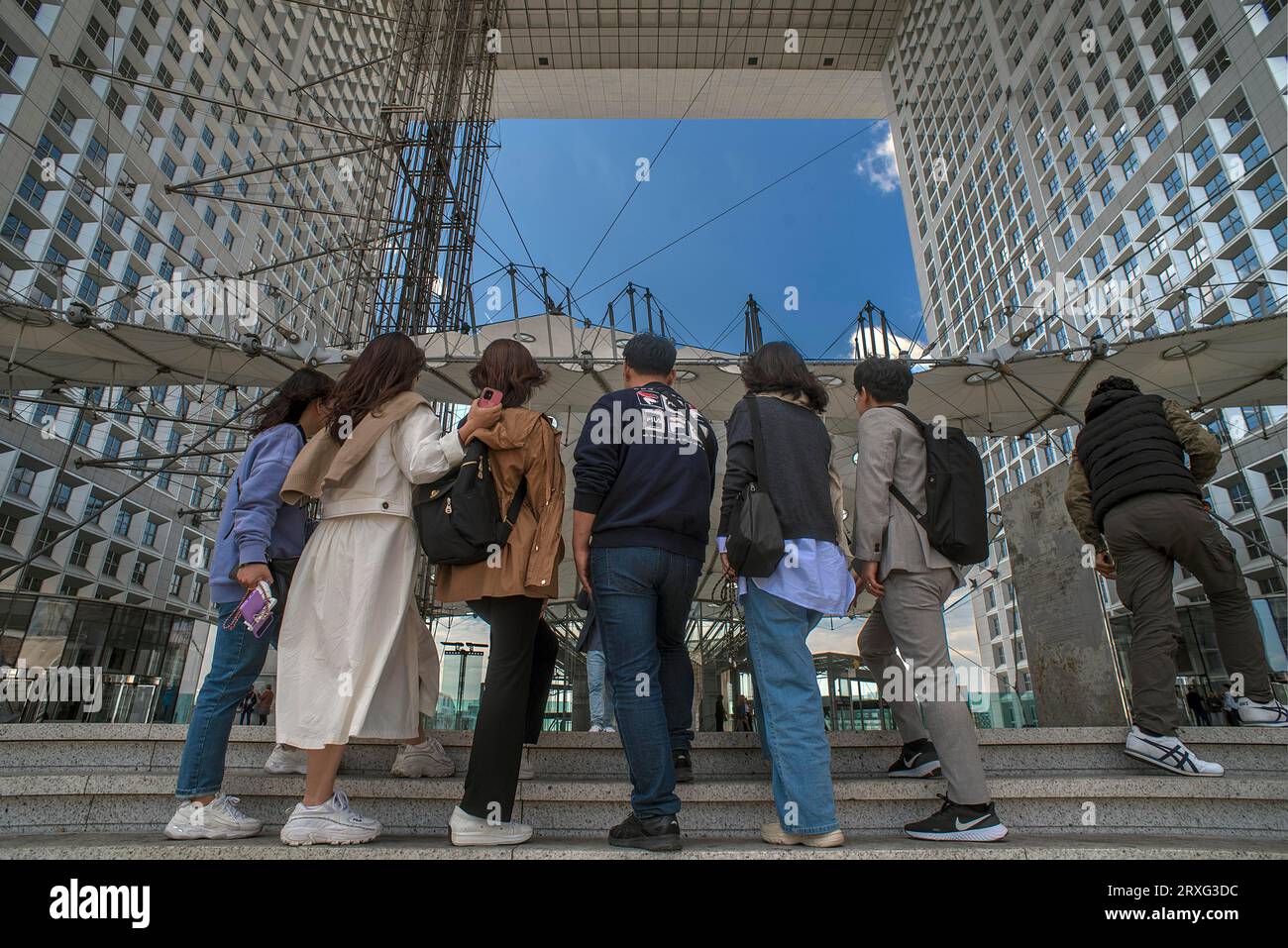 Tourists take a souvenir photo in the Grand Arche, La Defence, the New ...