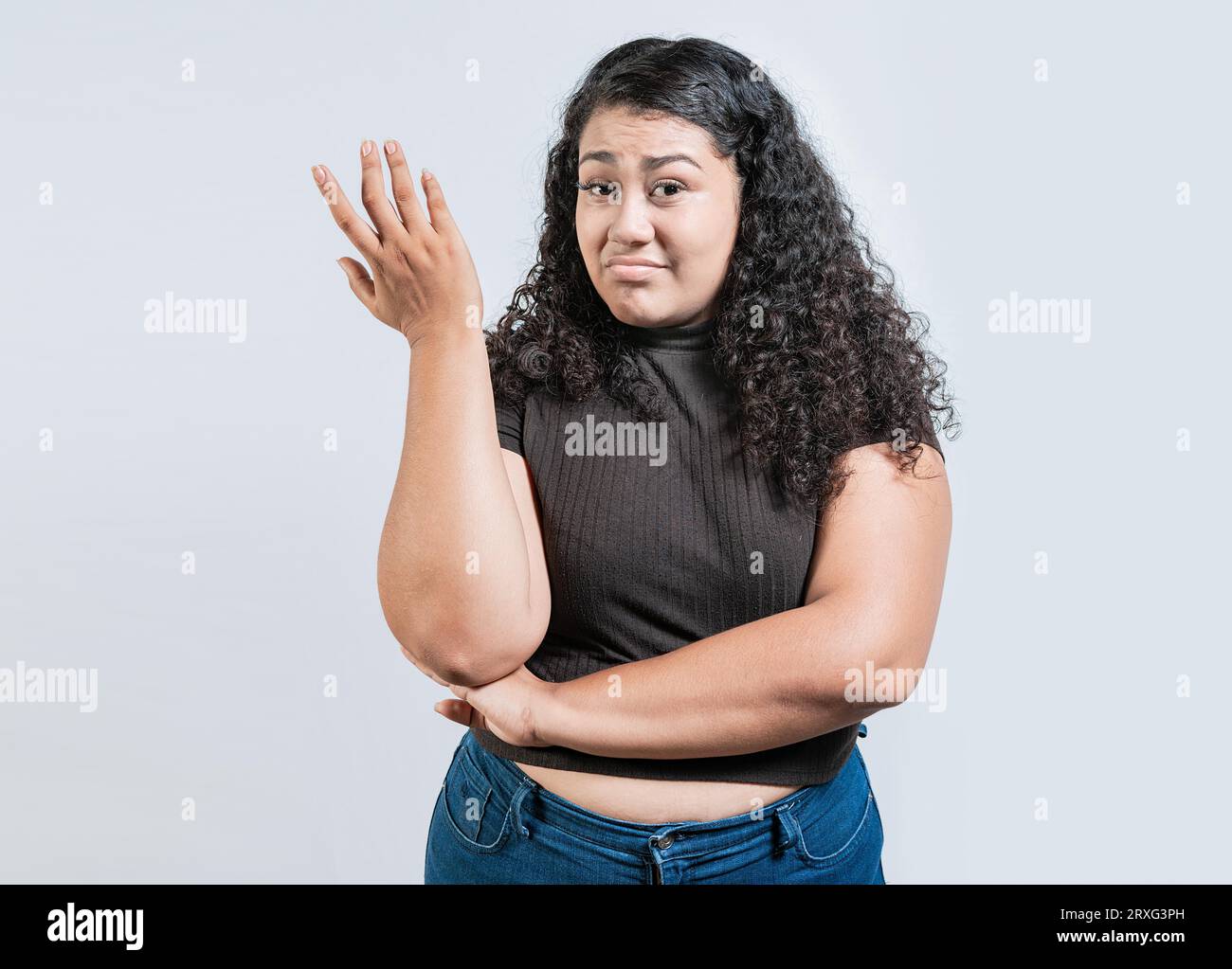 Puzzled woman gesturing with hand isolated. Girl with puzzled face ...