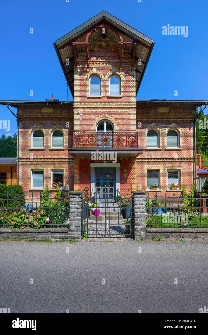 House with clinker facade, round arch windows and front garden, Allgaeu ...