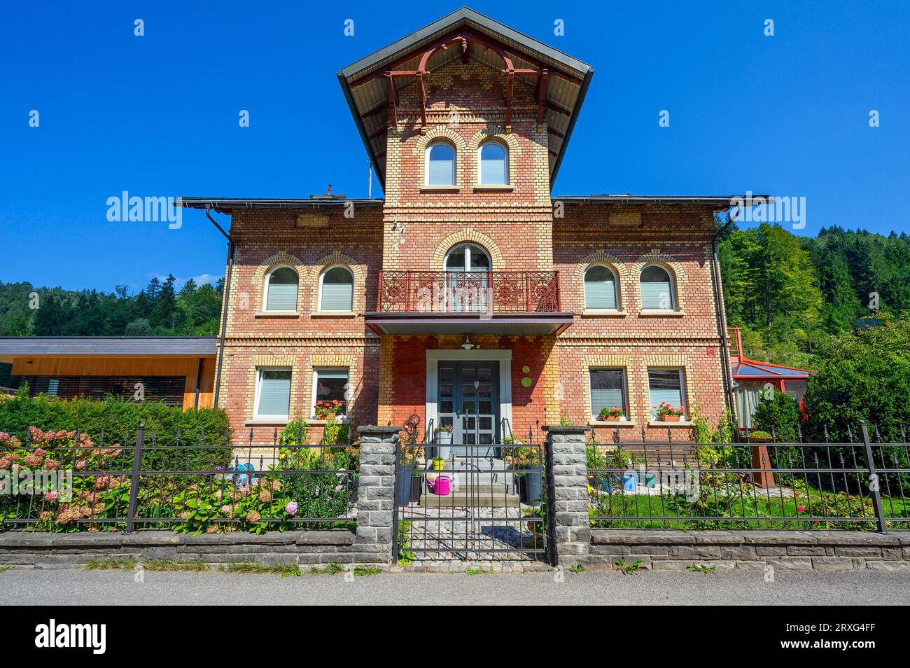 House with clinker facade, round arch windows and front garden, Allgaeu ...