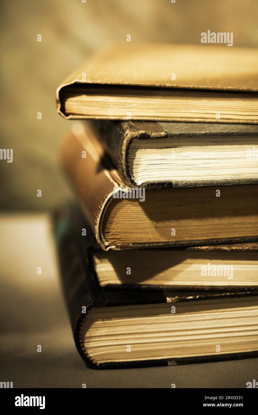 Sepia toned image of stacked books Stock Photo - Alamy