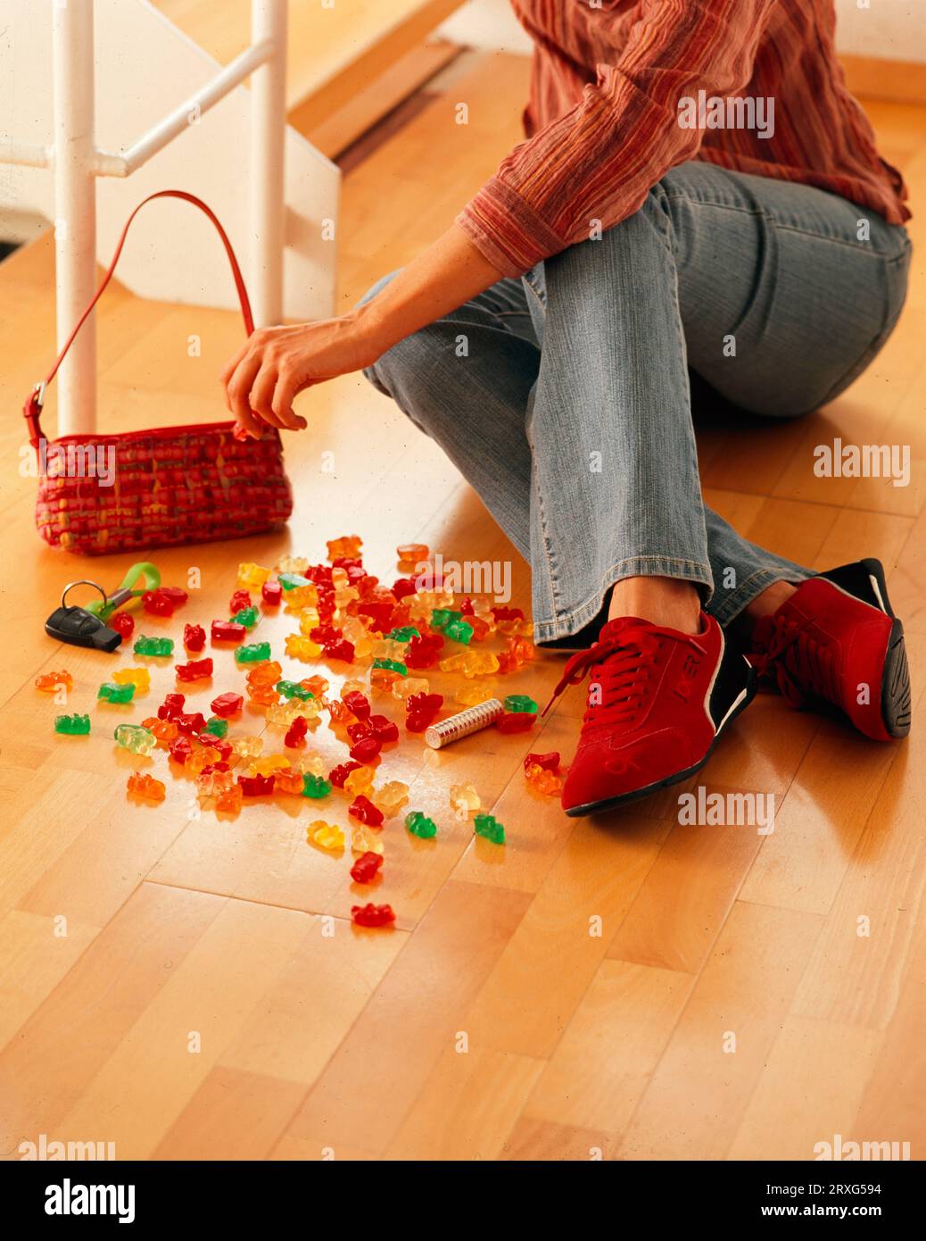 Women's legs with gummy bears, handbag Digital recording Stock Photo ...