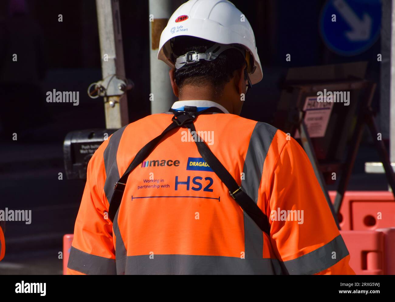 London, UK. 25th September 2023. A worker walks past the HS2 ...