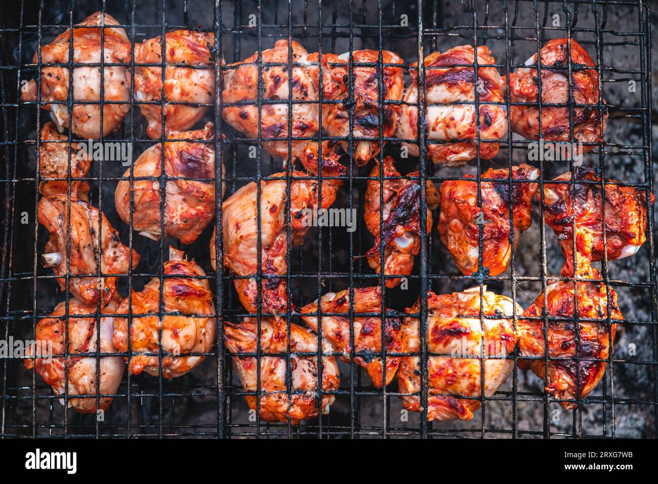 golden brown grilled chicken meat is cooked on the grill outdoors Stock ...