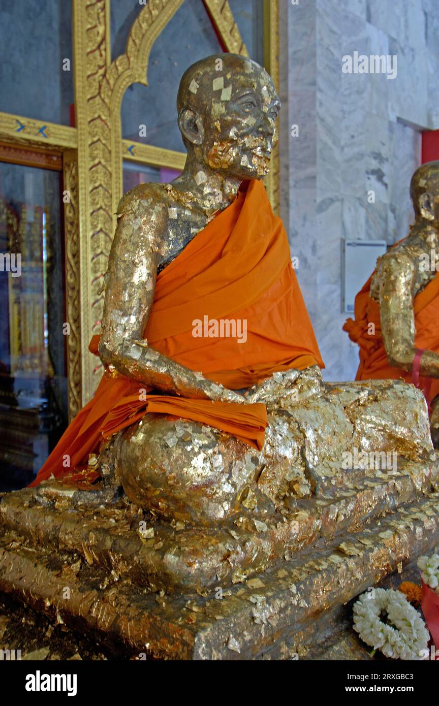 Statue of a monk covered with a golden plate, Wat Chalong Temple ...