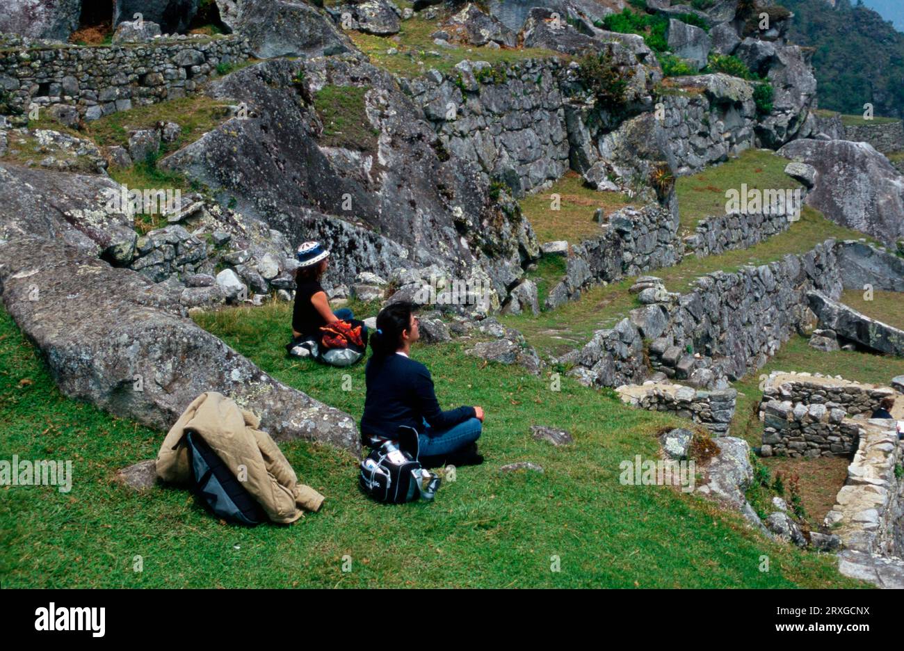 Women meditating at the sacred site of Inticancha, Machu Picchu, Peru ...