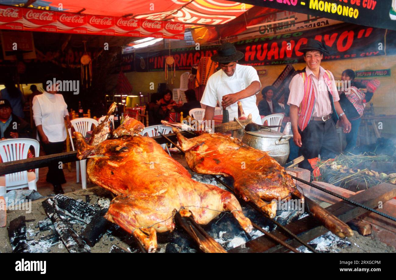 Men grilling at a market stall, Conception near Huancayo, Peru Stock ...