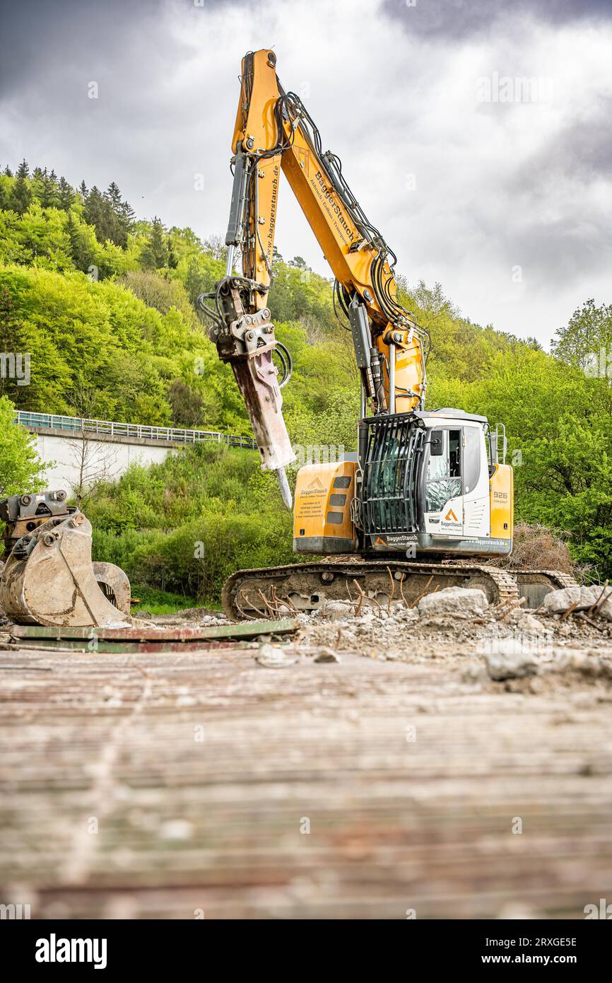 Yellow Liebherr crawler excavator recycling on demolition site Stock ...