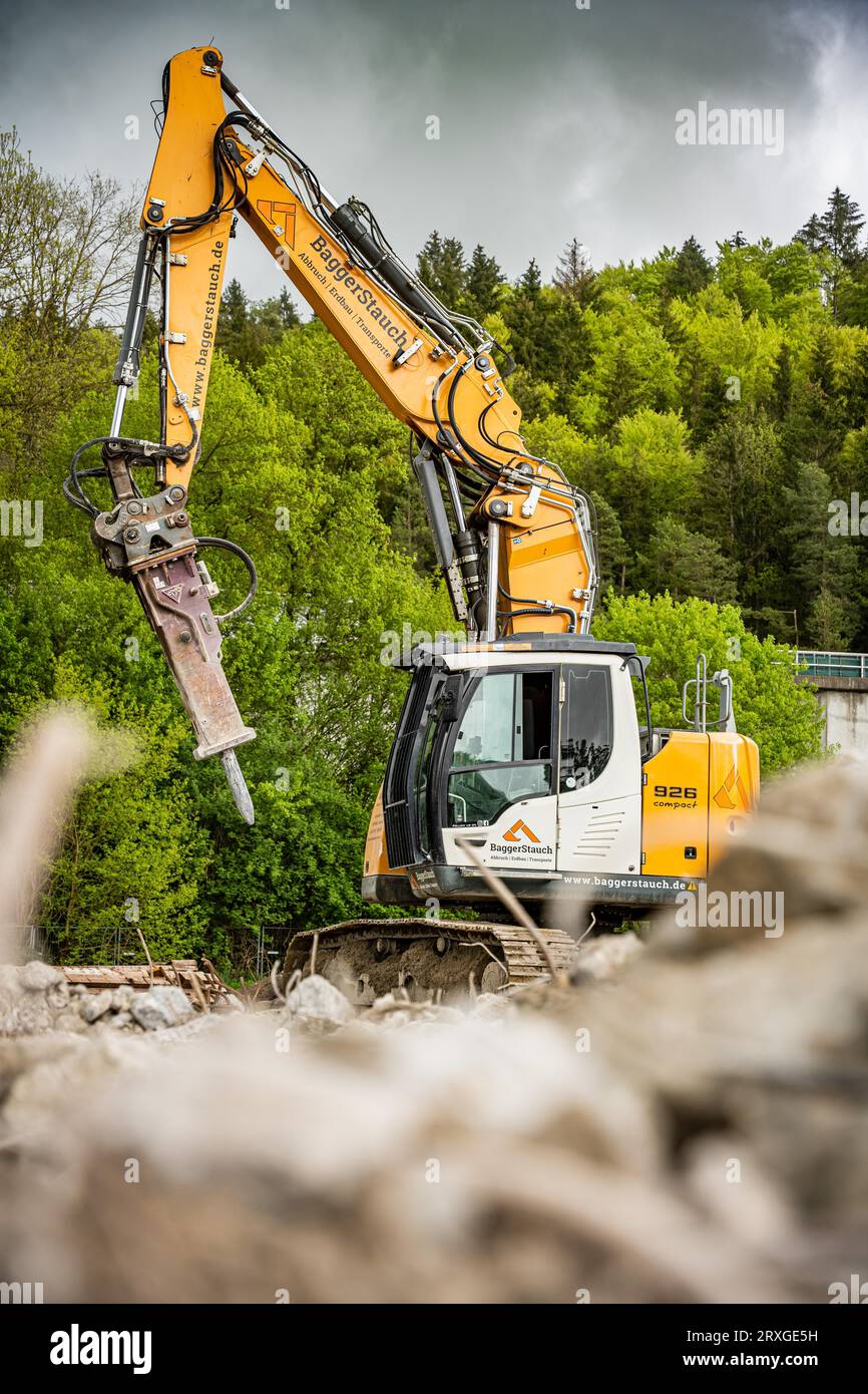 Yellow Liebherr crawler excavator recycling on demolition site Stock ...