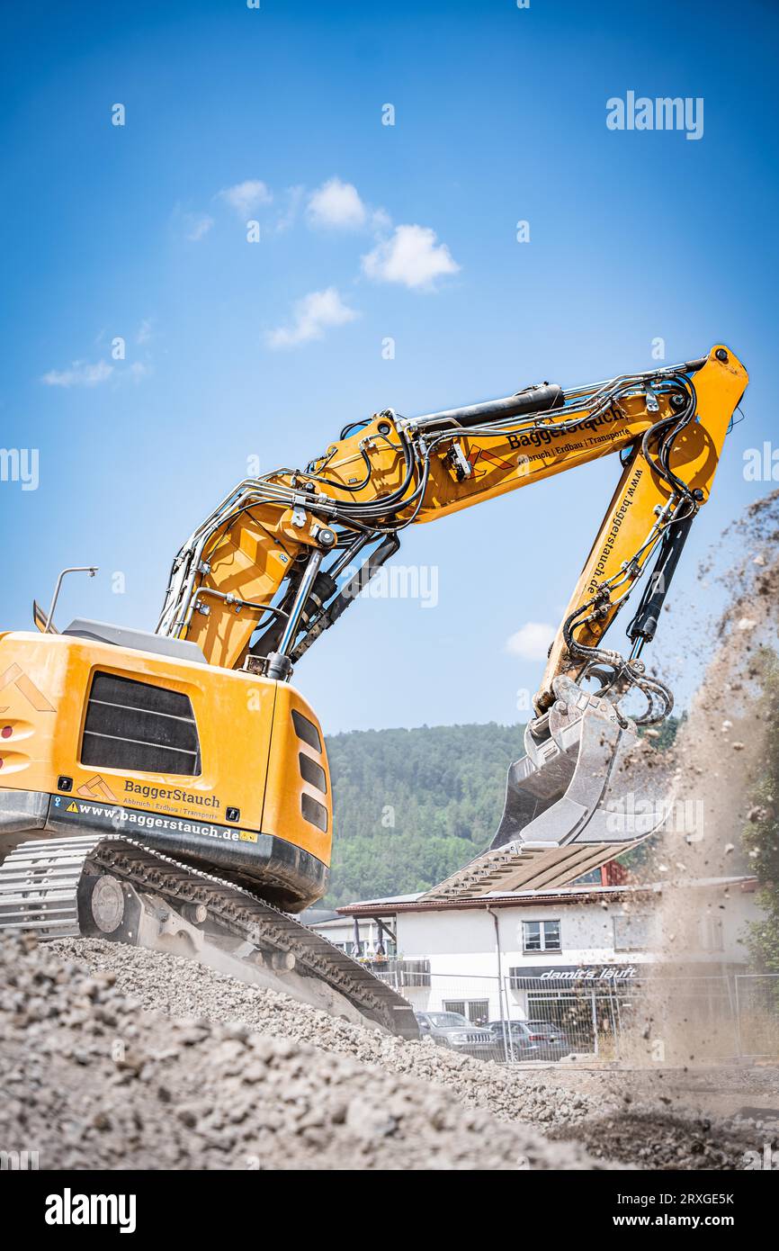 Yellow Liebherr crawler excavator recycling on demolition site Stock ...