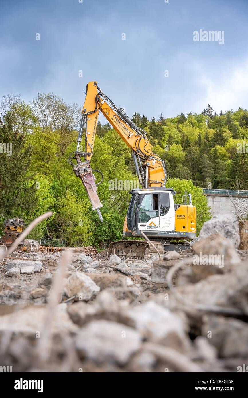 Yellow Liebherr crawler excavator recycling on demolition site Stock ...
